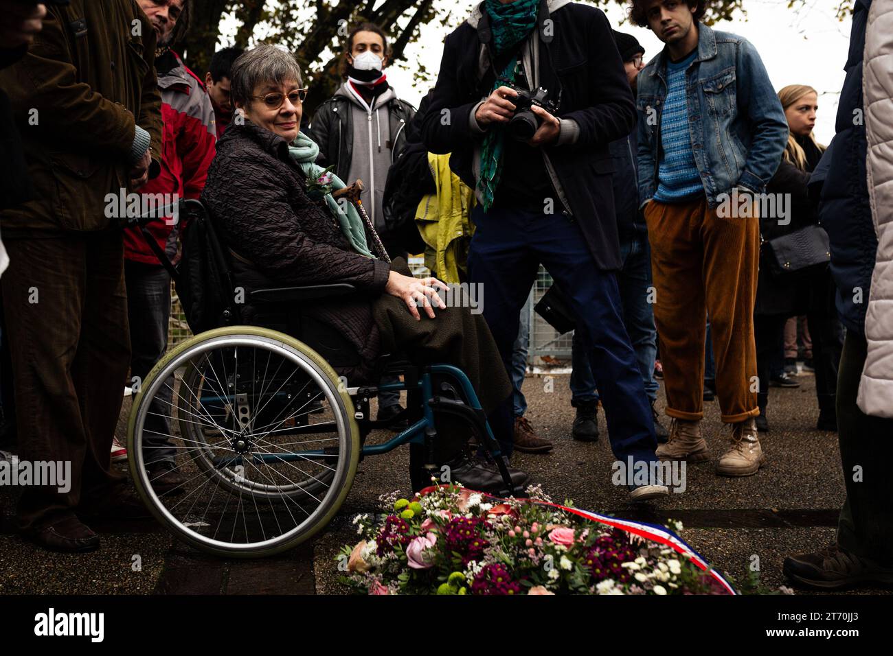 An Old Lady Gets Emotional Looking To The Flowers In Memory Of The Victims Of Antisemitic Acts