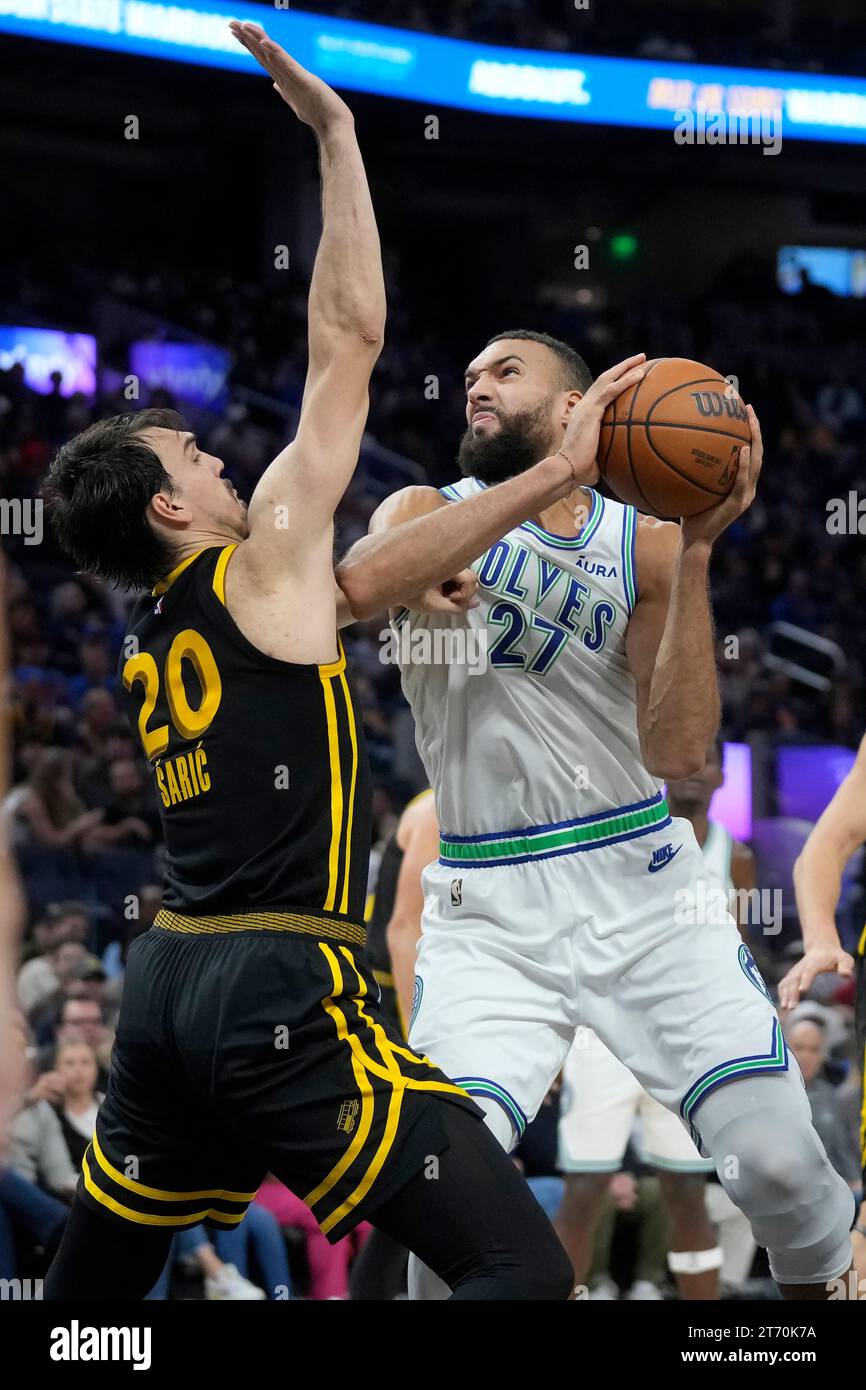 Minnesota Timberwolves center Rudy Gobert (27) shoots against Golden State Warriors forward ...