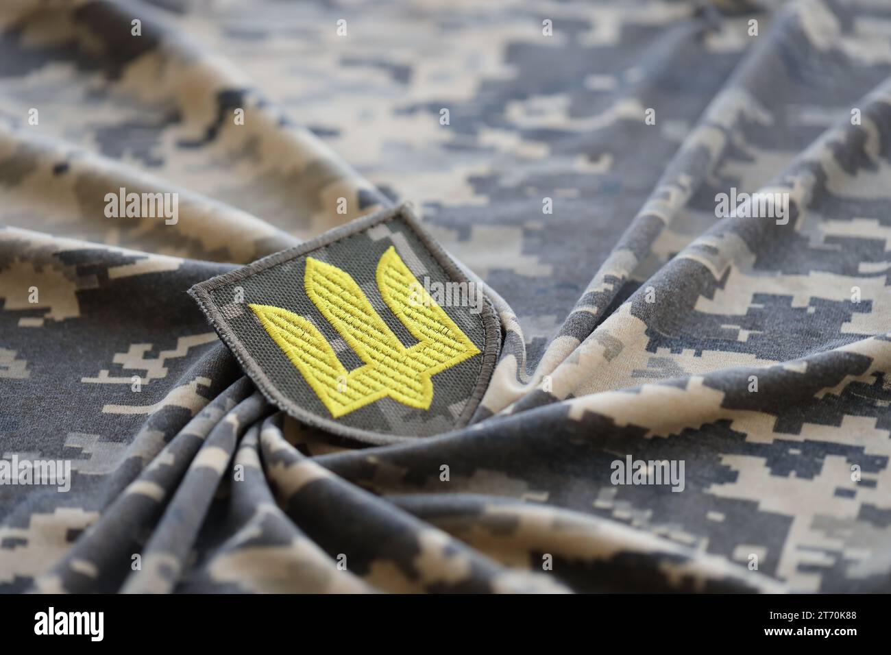 Symbol of Ukrainian army on the camouflage uniform of a Ukrainian ...