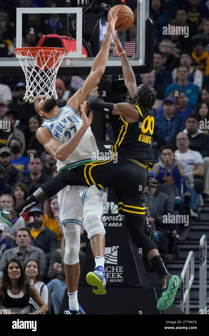 Minnesota Timberwolves center Rudy Gobert, left, defends against a shot ...