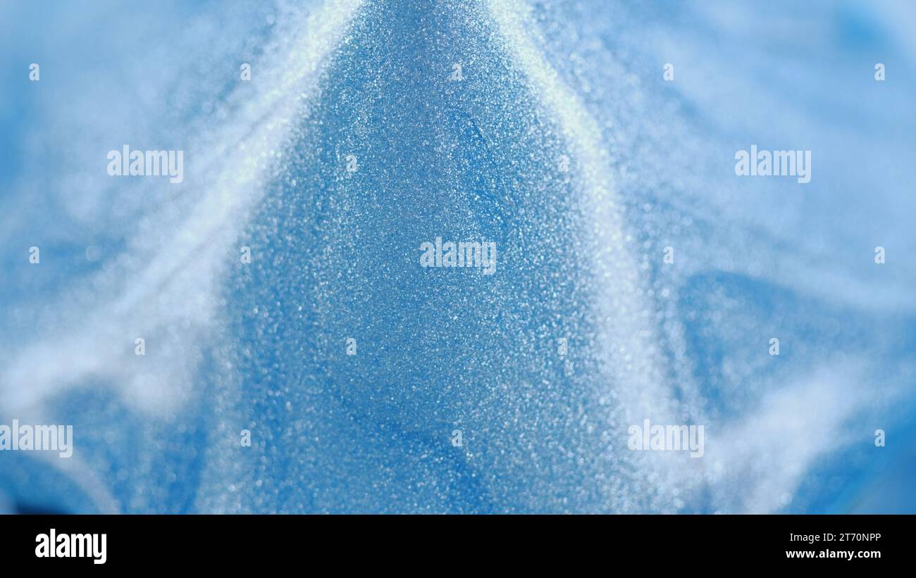 Glitter fluid paint flow blue wet texture ink wave Stock Photo - Alamy