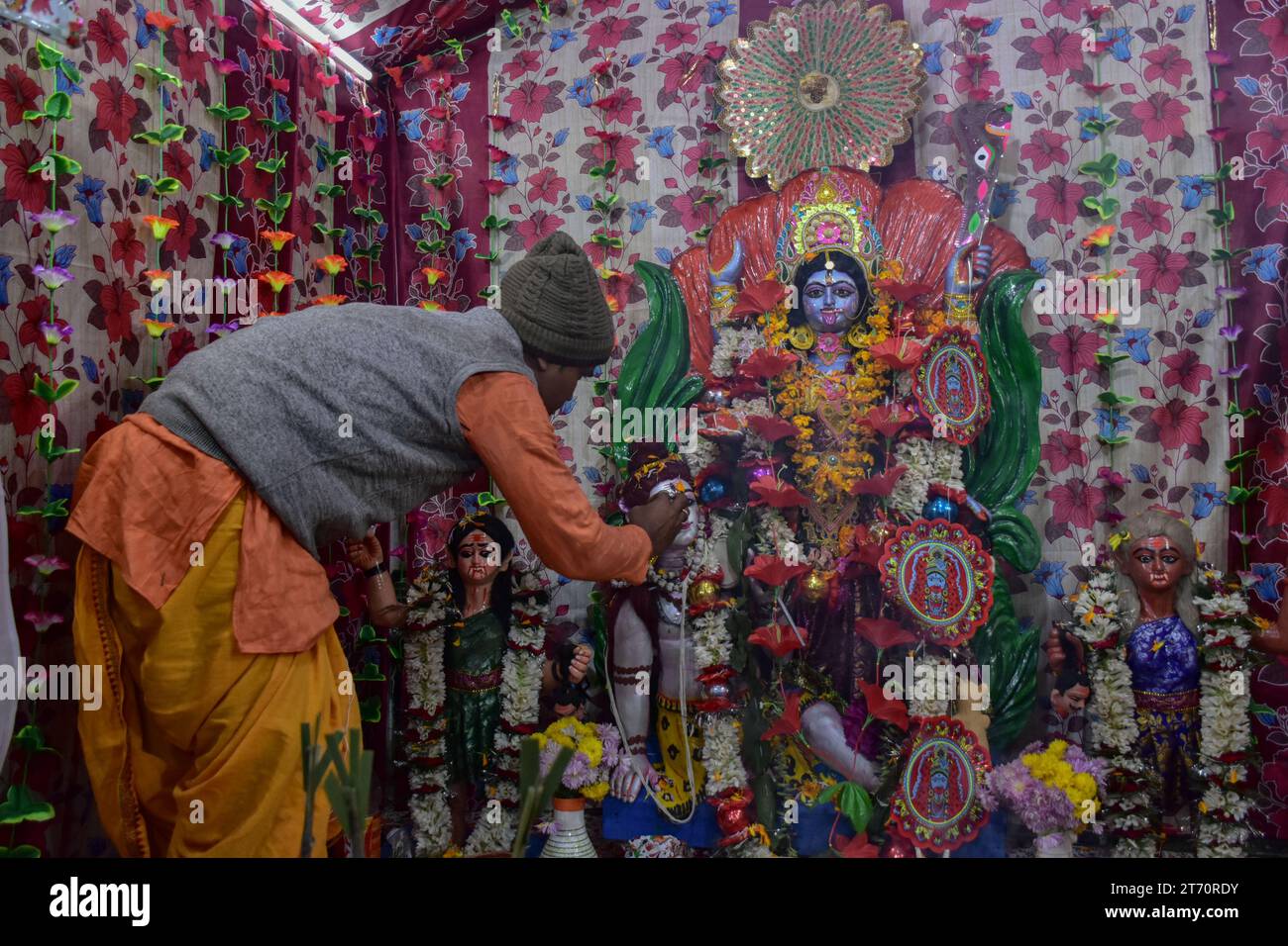 A Hindu priest perform rituals inside the temple on the occasion of ...
