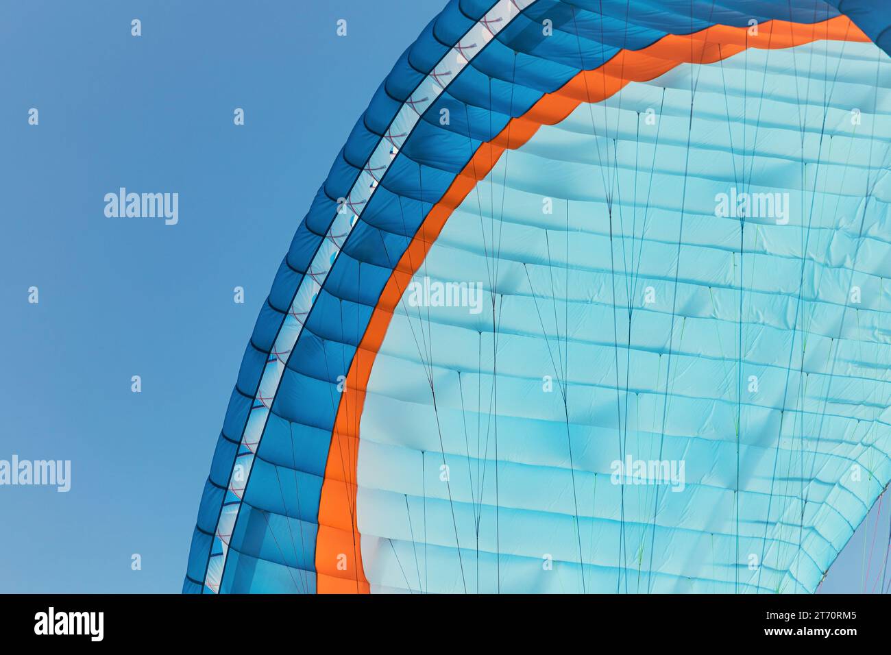 Colorful paraglider close-up against the blue sky. High quality photo ...