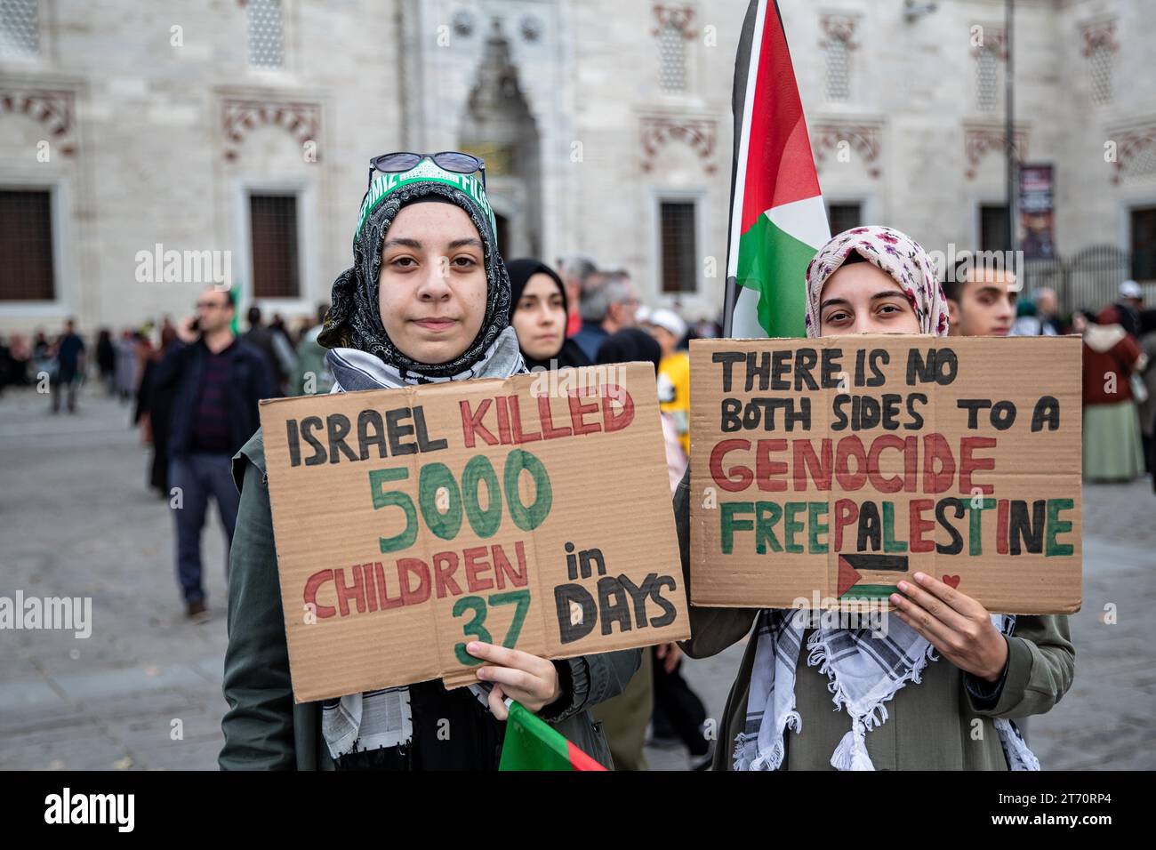 Two demonstrators supporting Palestine were seen holding banners saying ...