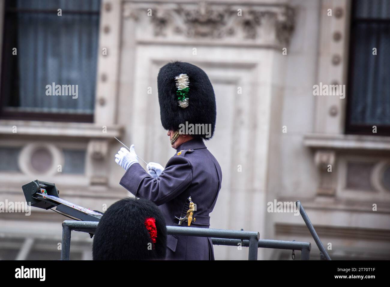 A conductor performs during The 2023 National Service of Remembrance ...