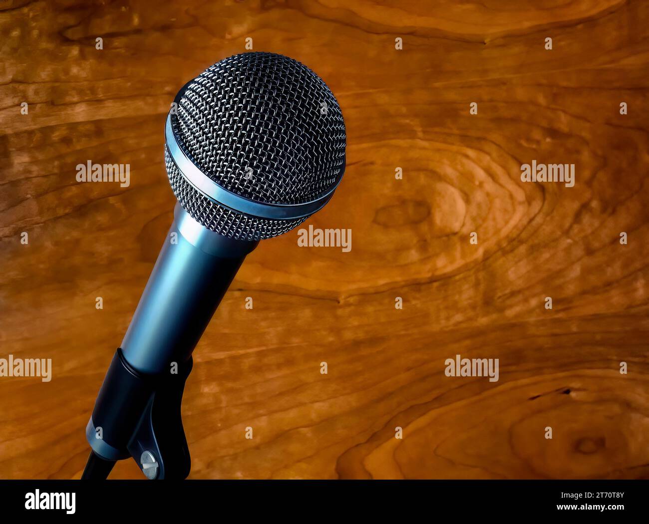 Microphone on a stand with wood background Stock Photo - Alamy
