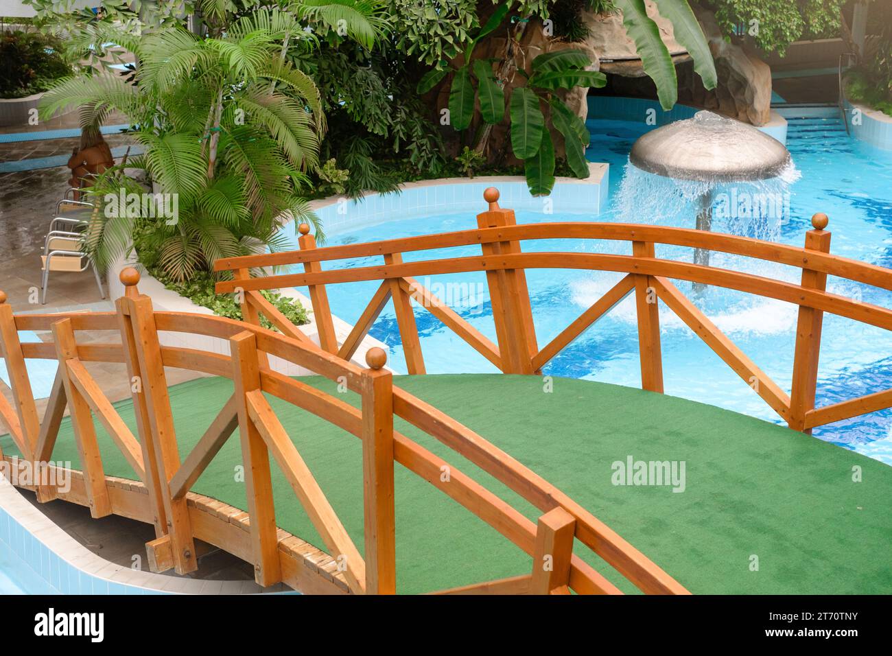 Water fountain in aquapark. Mushroom shape fountain in indoor adventure ...