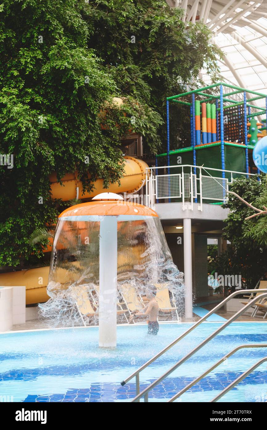 Water fountain in aquapark. Mushroom shape fountain in indoor adventure ...