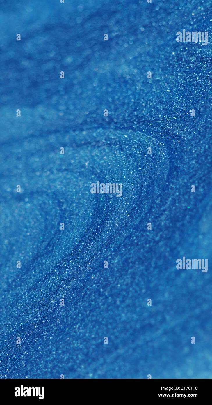 Glitter fluid paint flow blue wet texture ink wave Stock Photo - Alamy