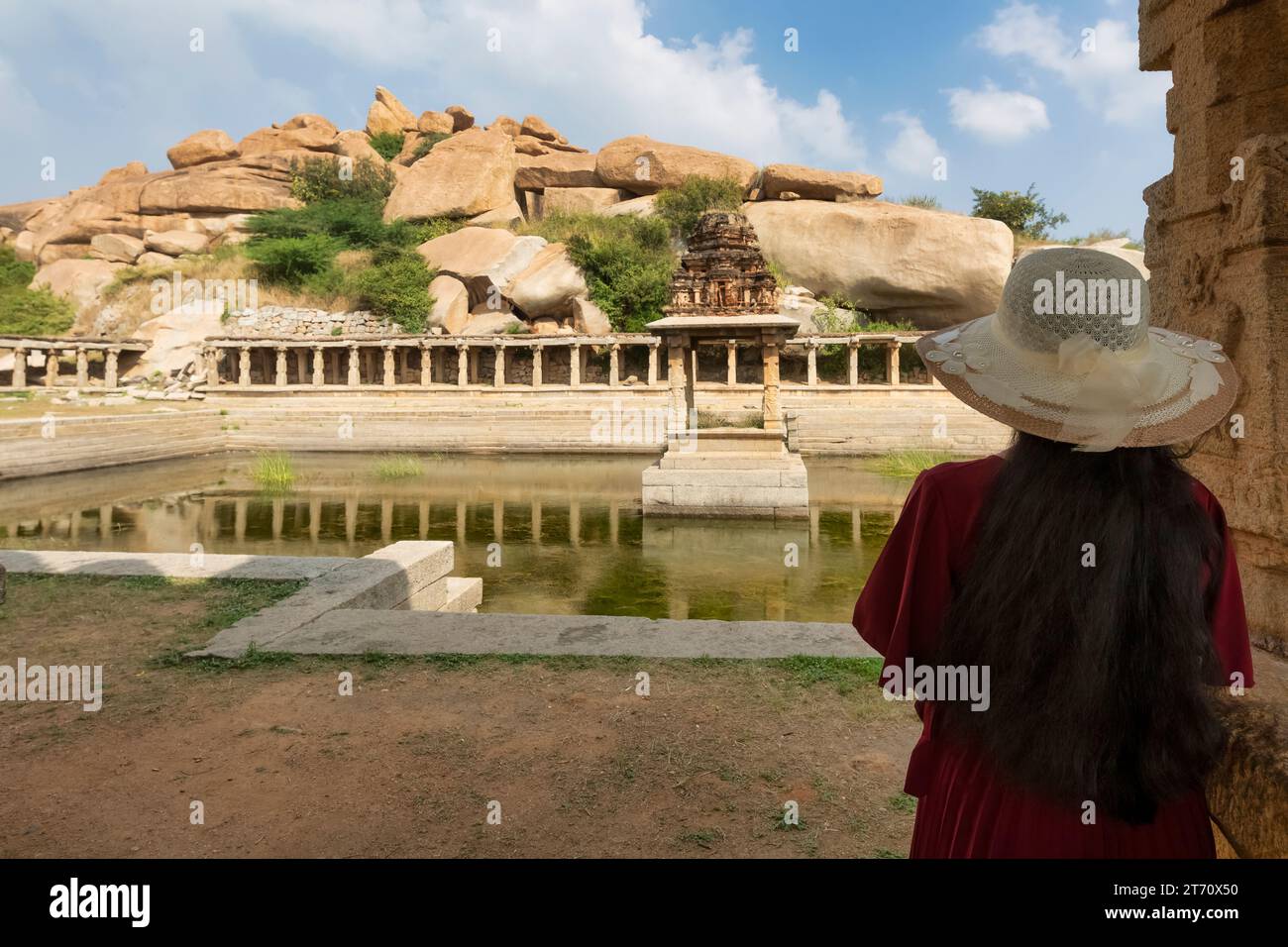 Woman tourist enjoy view of Pushkarani an ancient water reservoir at ...