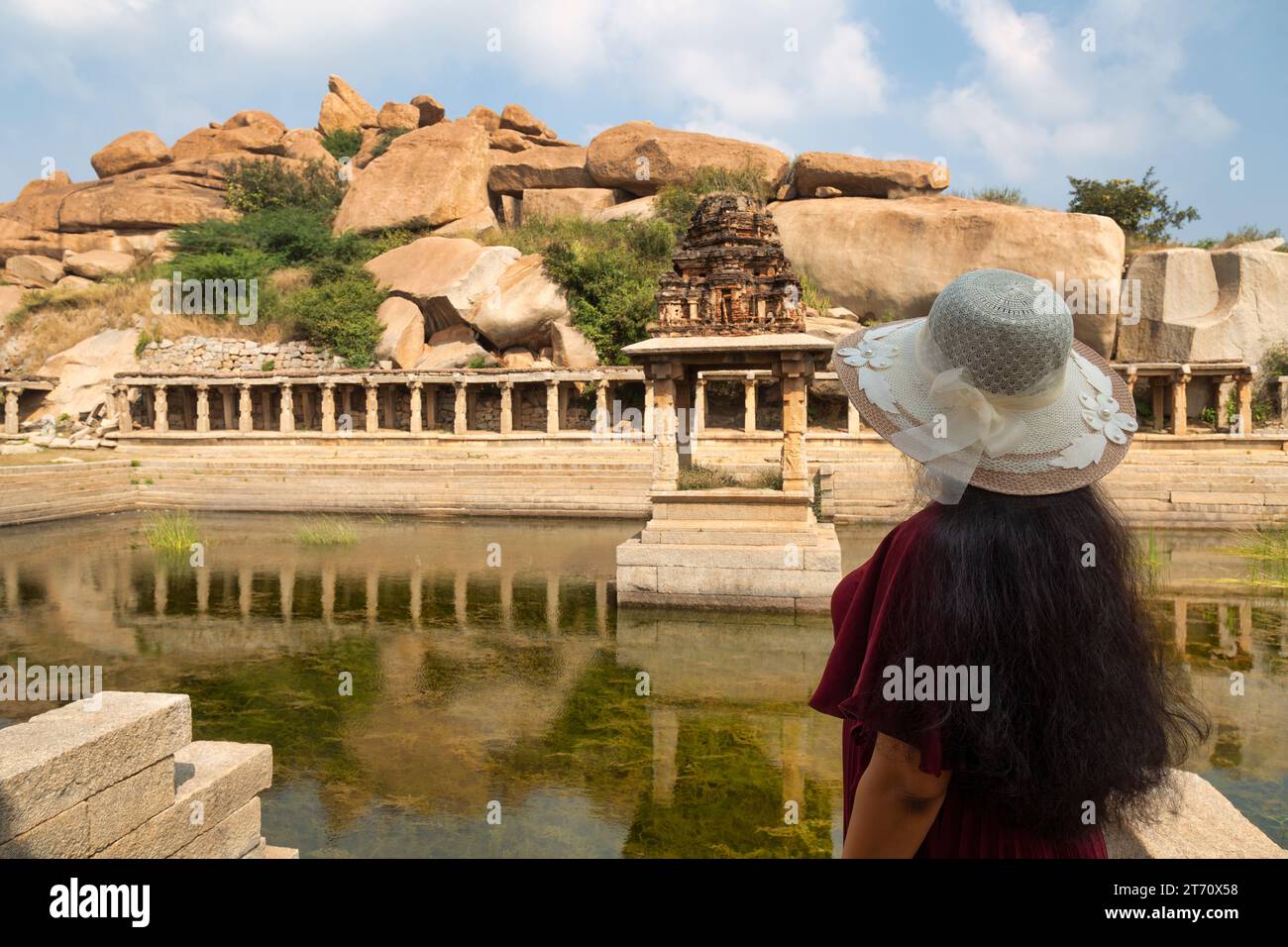 Woman tourist enjoy view of Pushkarani an ancient water reservoir at ...