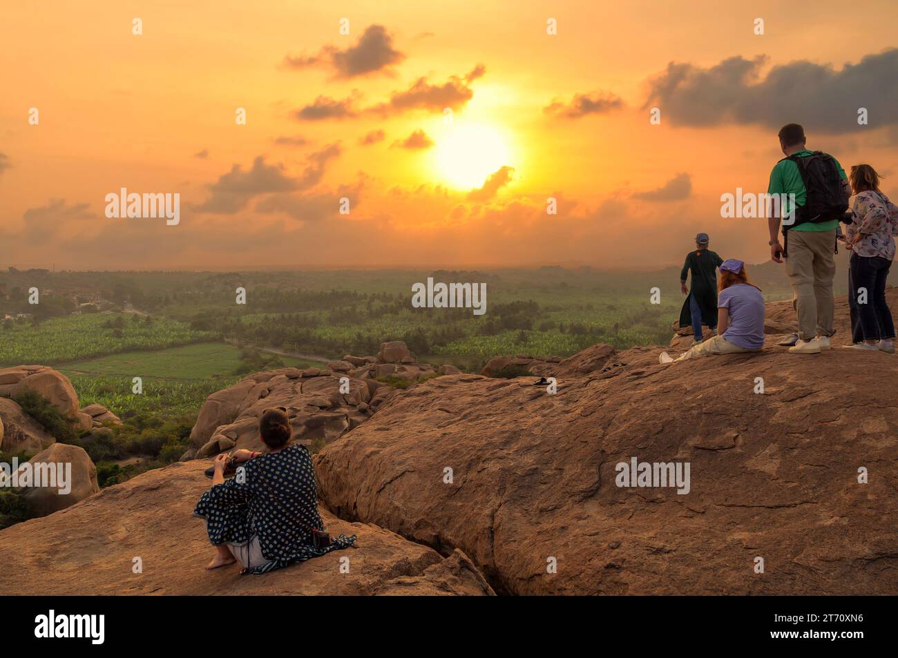 Tourist enjoy sunset view with rural landscape from top of a hill at ...