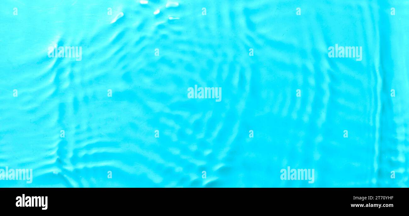 Transparent blue color water ripple with copy space. Defocused and ...