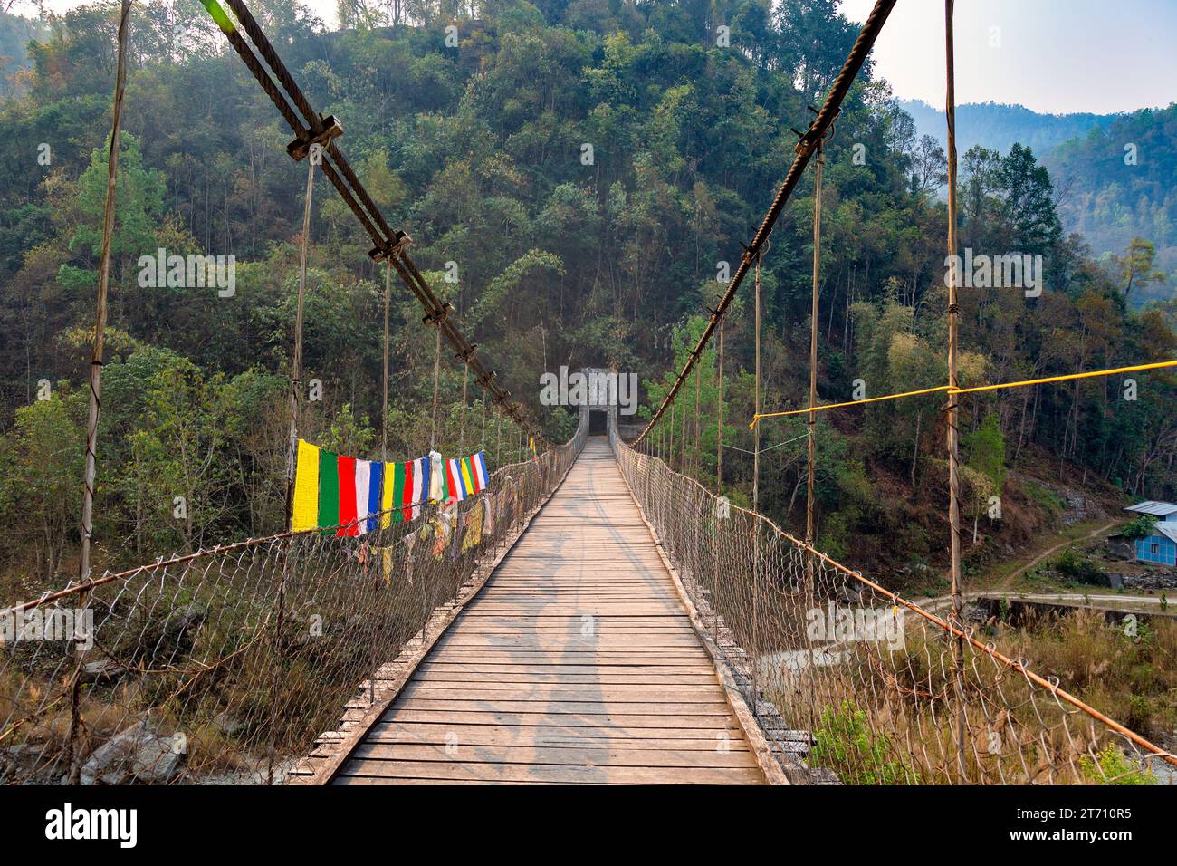 Hanging wooden bridge on Railey river surrounded by mountains at ...