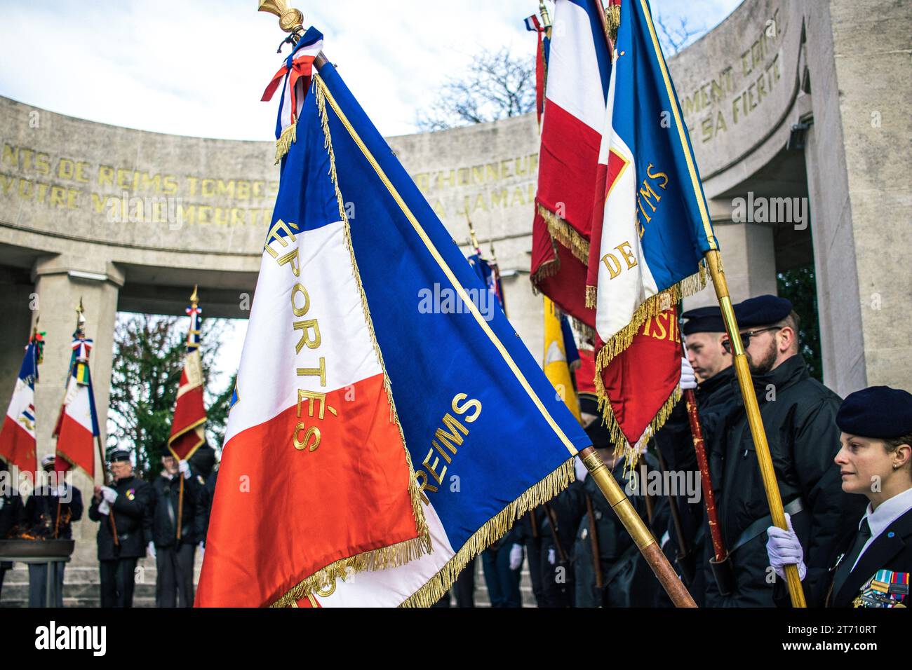 Reims, France - November 11, 2023 Veterans carry flags in the ...