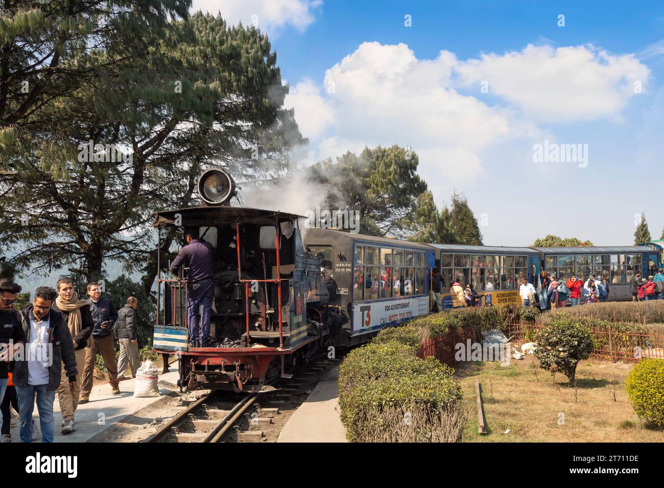 Toy train of the Darjeeling Himalayan railway with view of tourists at ...