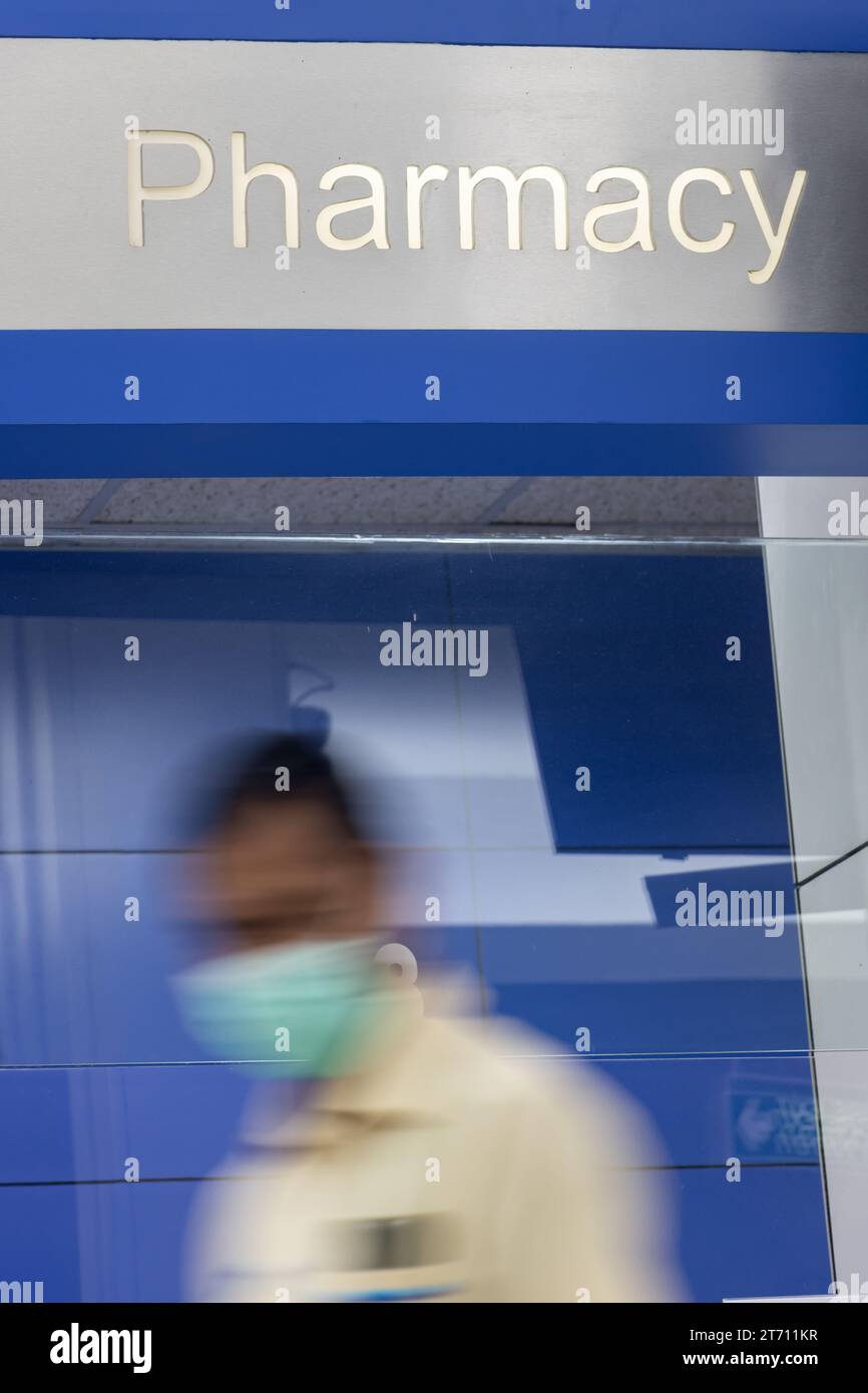 Pharmacy dispensing window with motion blurred staff Stock Photo - Alamy