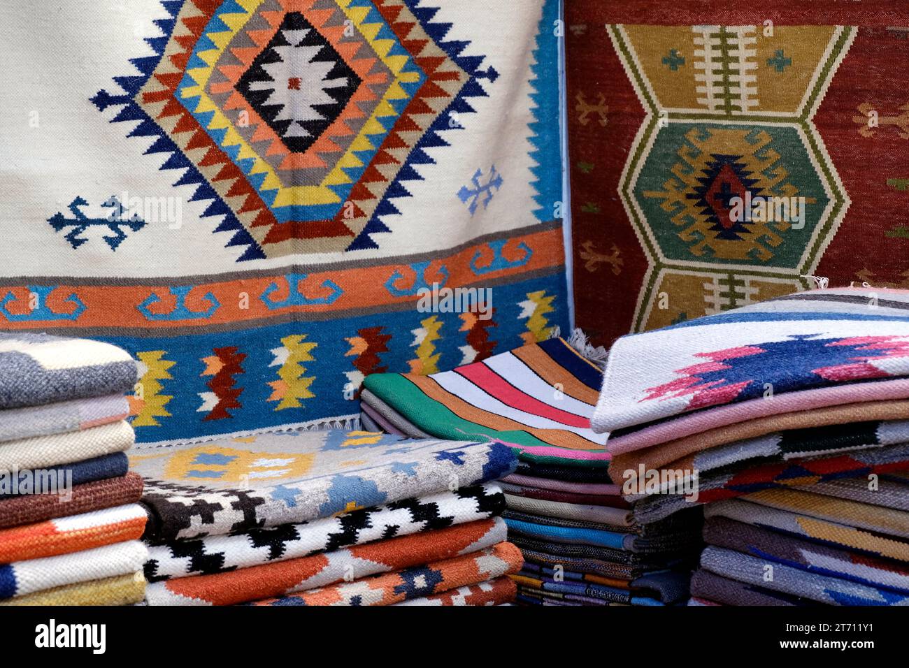 Carpet being rolled and displayed at a carpet exhibition in pune ...