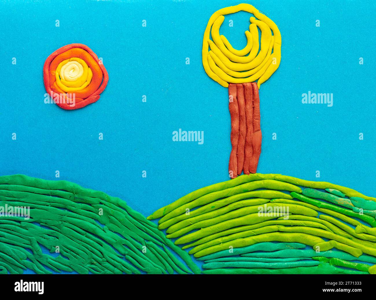 Diy made from plasticine by child sun and tree on green grass Stock ...