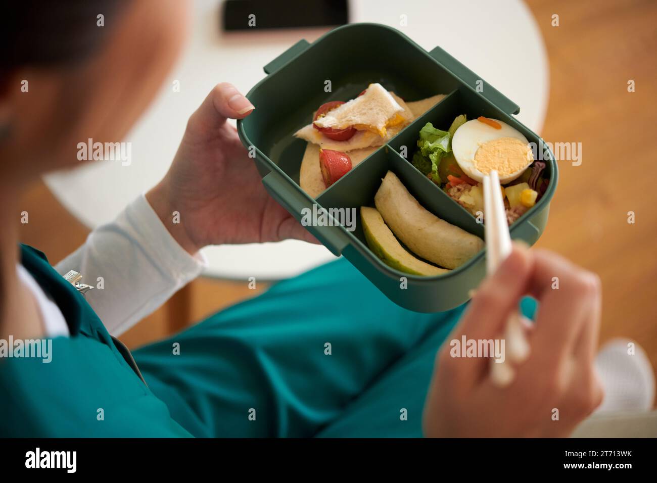 Medical nurse eating lunch she prepared at home, view from above Stock ...