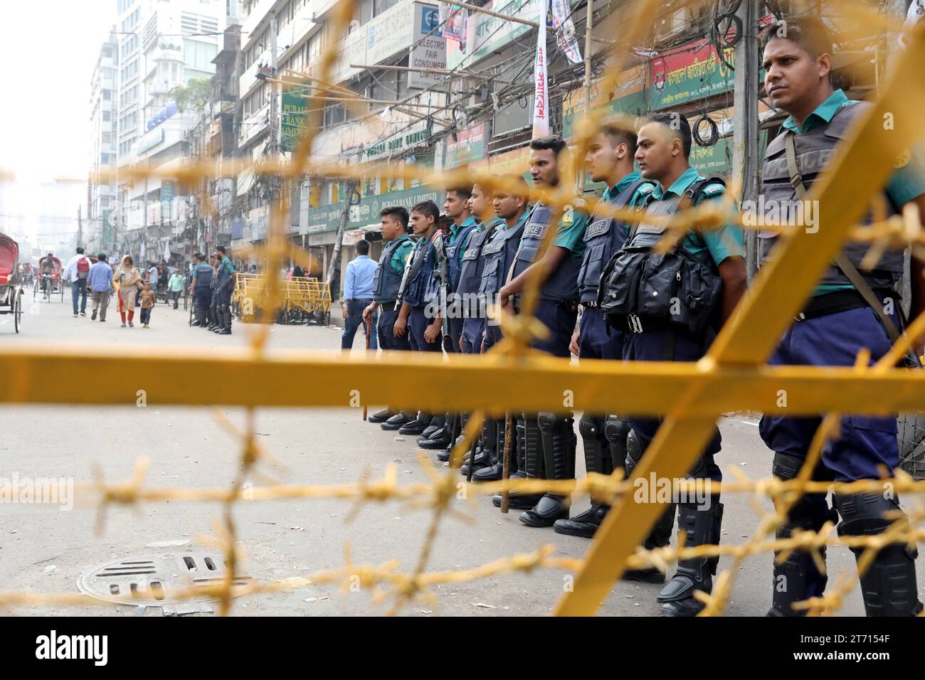 Police personnel stand guard in front of the Bangladesh Nationalist ...