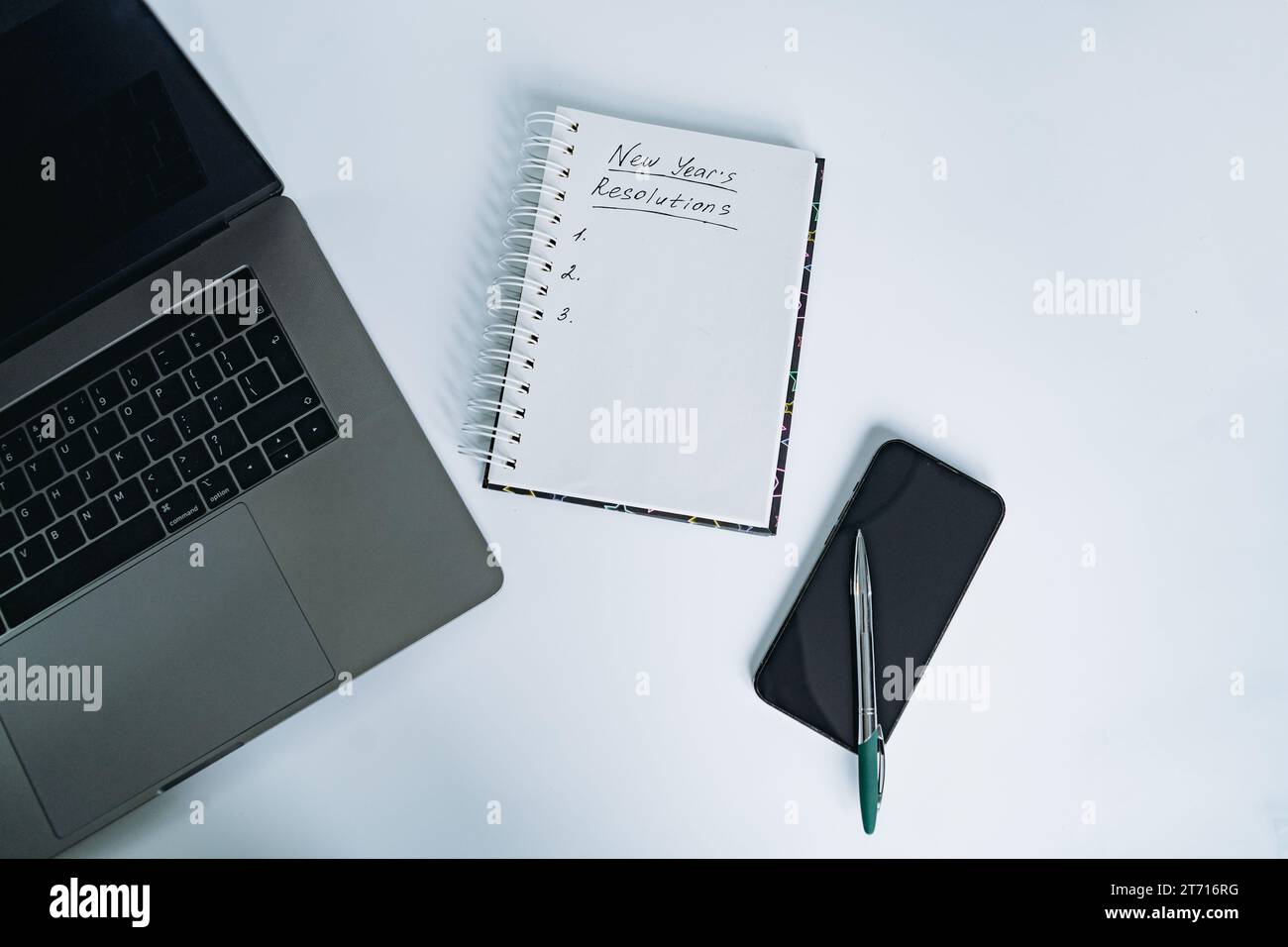 open notepad with resolutions for new 2024 year text. Near laptop, and ...