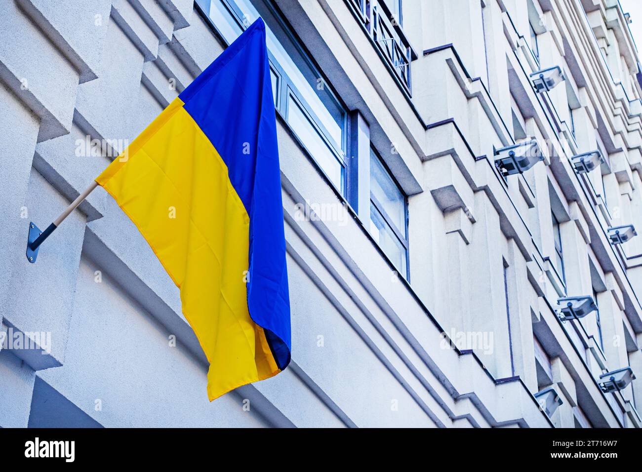 Ukrainian flag on an architectural building. Support and War in Ukraine ...