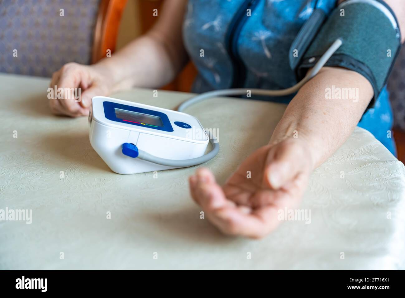 Senior woman checking blood pressure level at home, older female ...