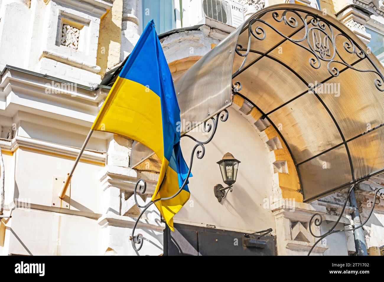 Ukrainian flag on an architectural building. Support and War in Ukraine ...