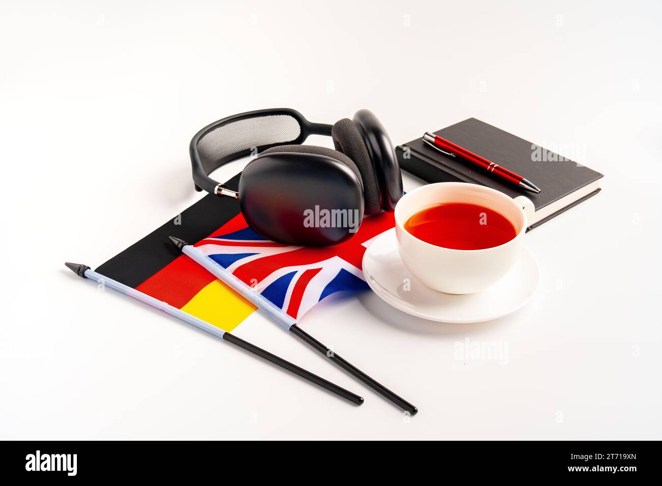 German and British flags with notepad on white background Stock Photo ...