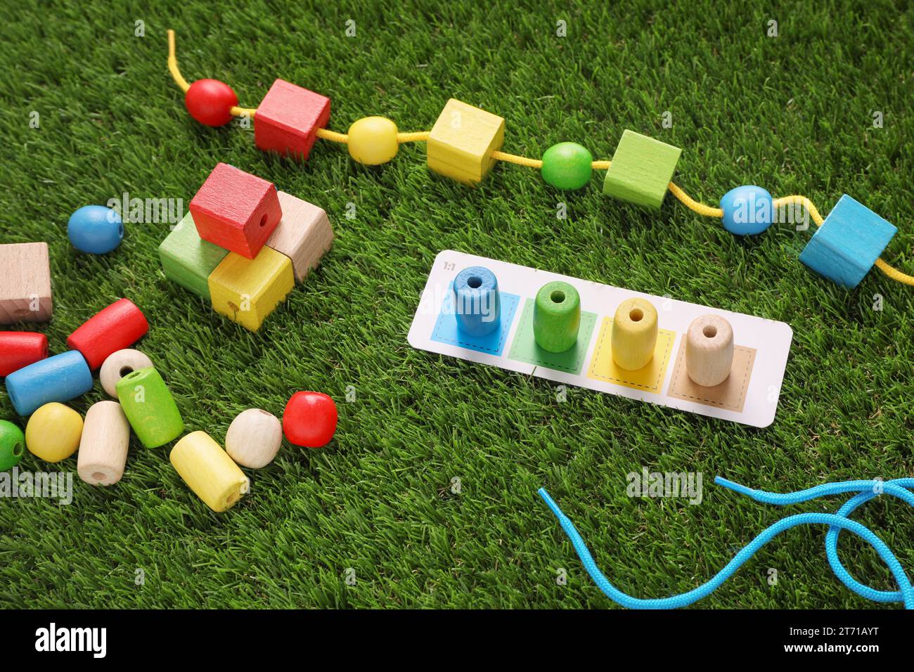 Educational toy for motor skills development on artificial grass Stock ...
