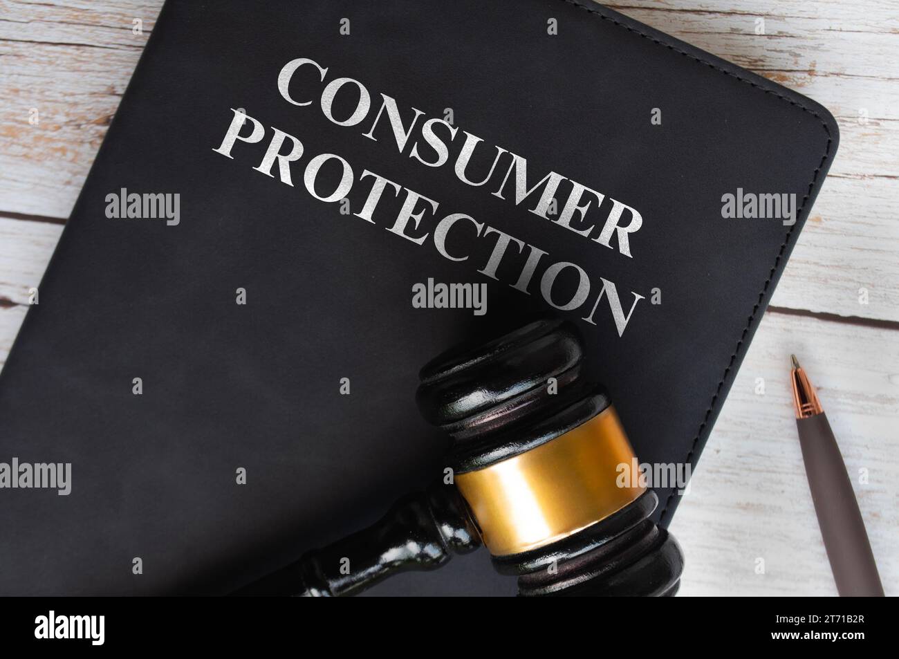 Top view of Consumer Protection text on black book with gavel ...