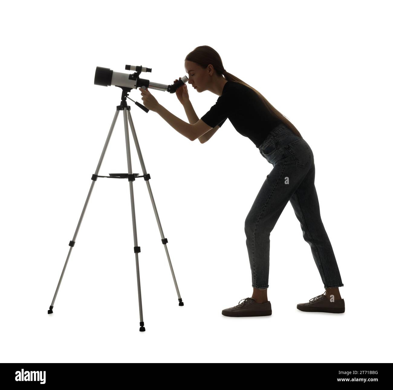 Young astronomer looking at stars through telescope on white background ...