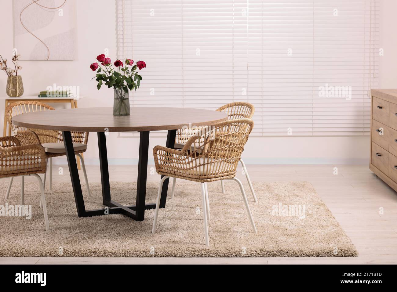 Stylish dining room interior with comfortable furniture. Space for text ...