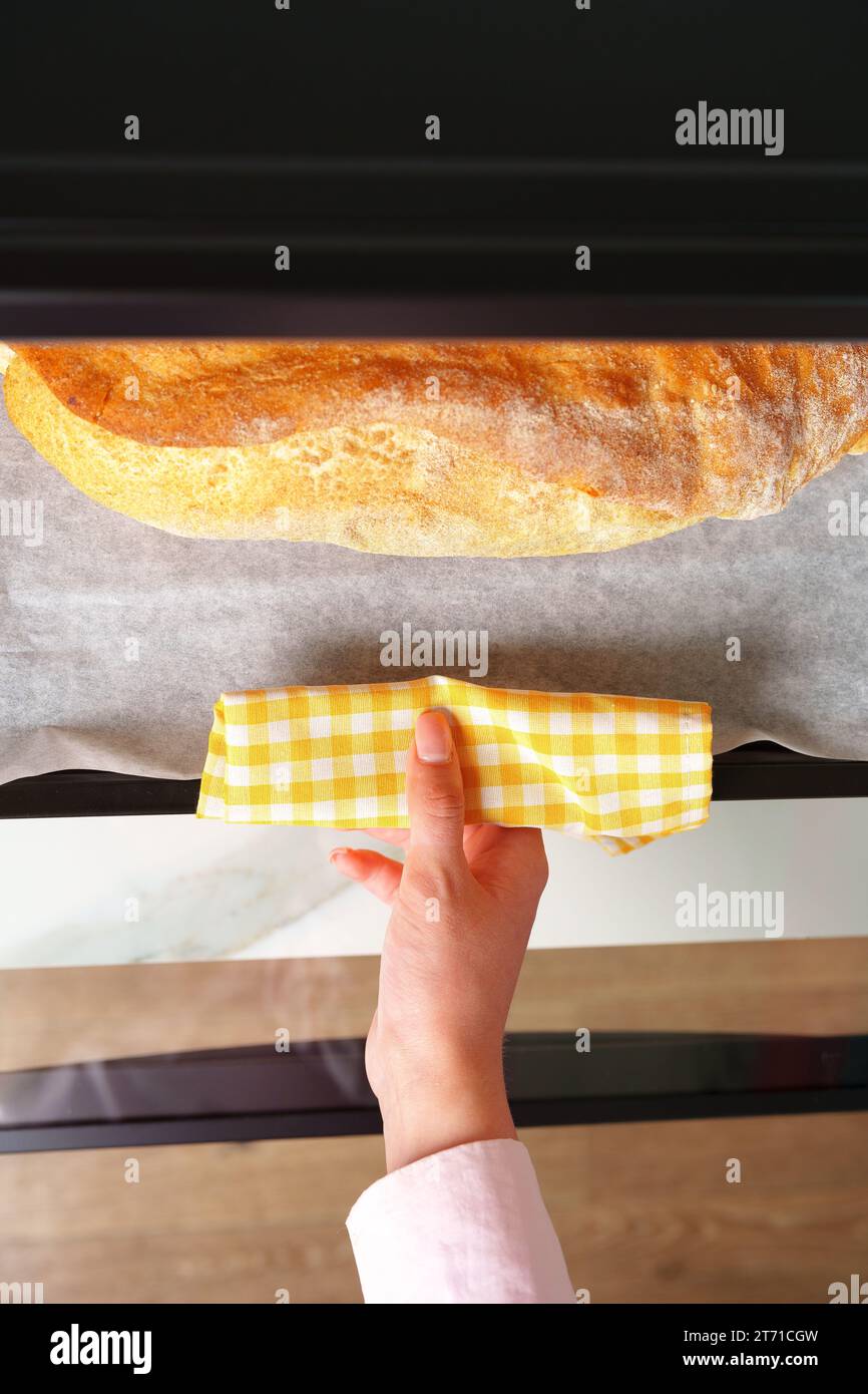 Woman hands open fresh bread hi-res stock photography and images - Alamy