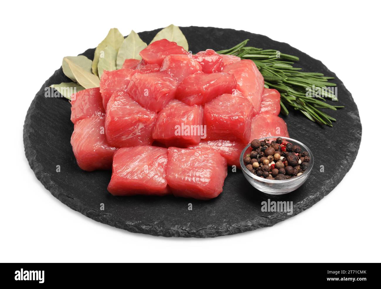 Pieces of raw beef, bay leaves, rosemary and peppercorns isolated on ...
