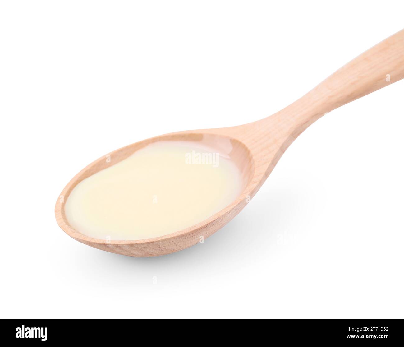 Condensed milk spoon on Cut Out Stock Images & Pictures - Alamy