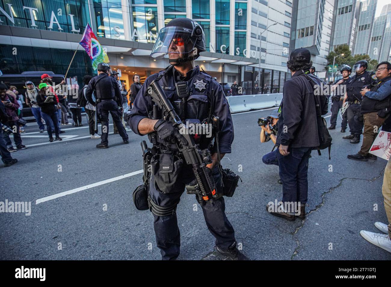 Riot police block the protestors from nearing the Moscone Center. The ...