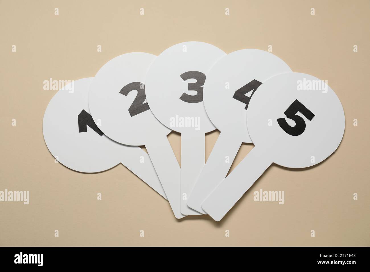 Auction paddles with numbers on beige background, flat lay Stock Photo ...