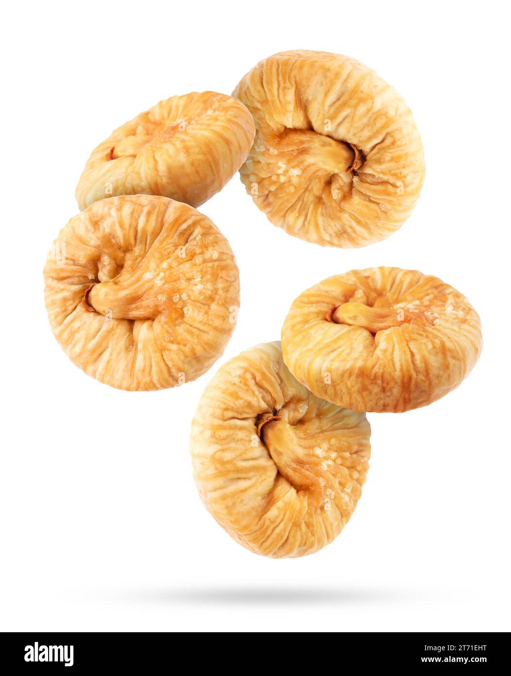 Many dried figs falling on white background Stock Photo - Alamy