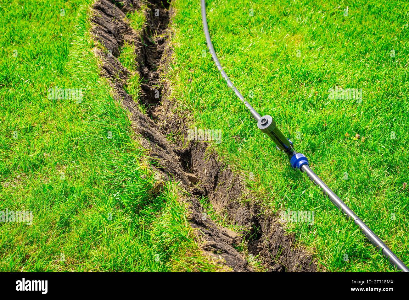 Installing a pop-up sprinkler in the lawn, close-up. Grass Irrigation ...