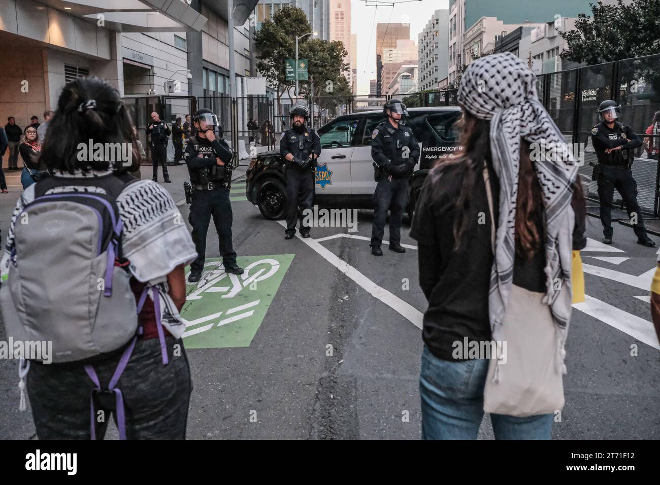 Riot police block the protestors from nearing the Moscone Center. The ...