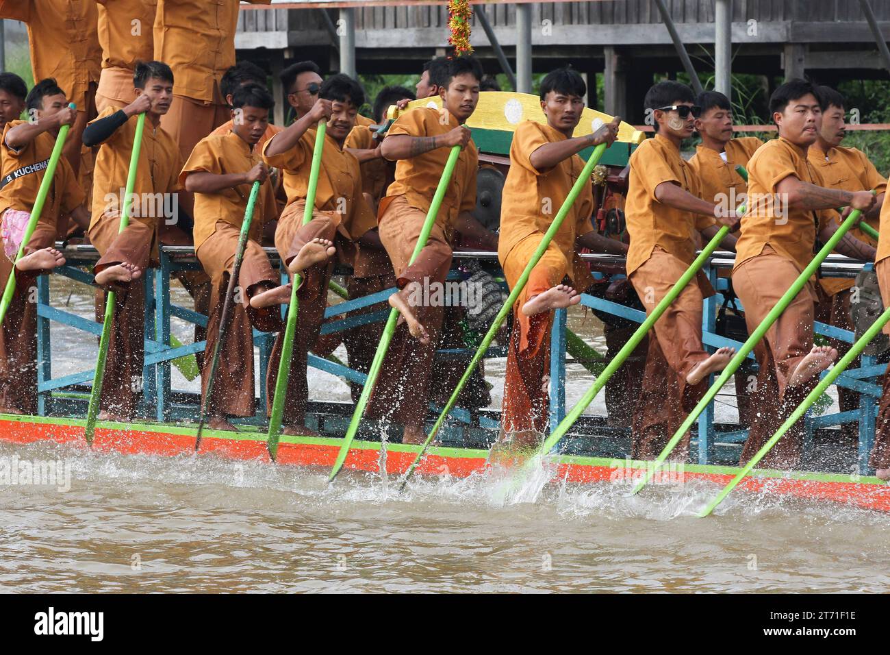 Ethnic Inntha men demonstrate their leg-rowing techniques during a ...