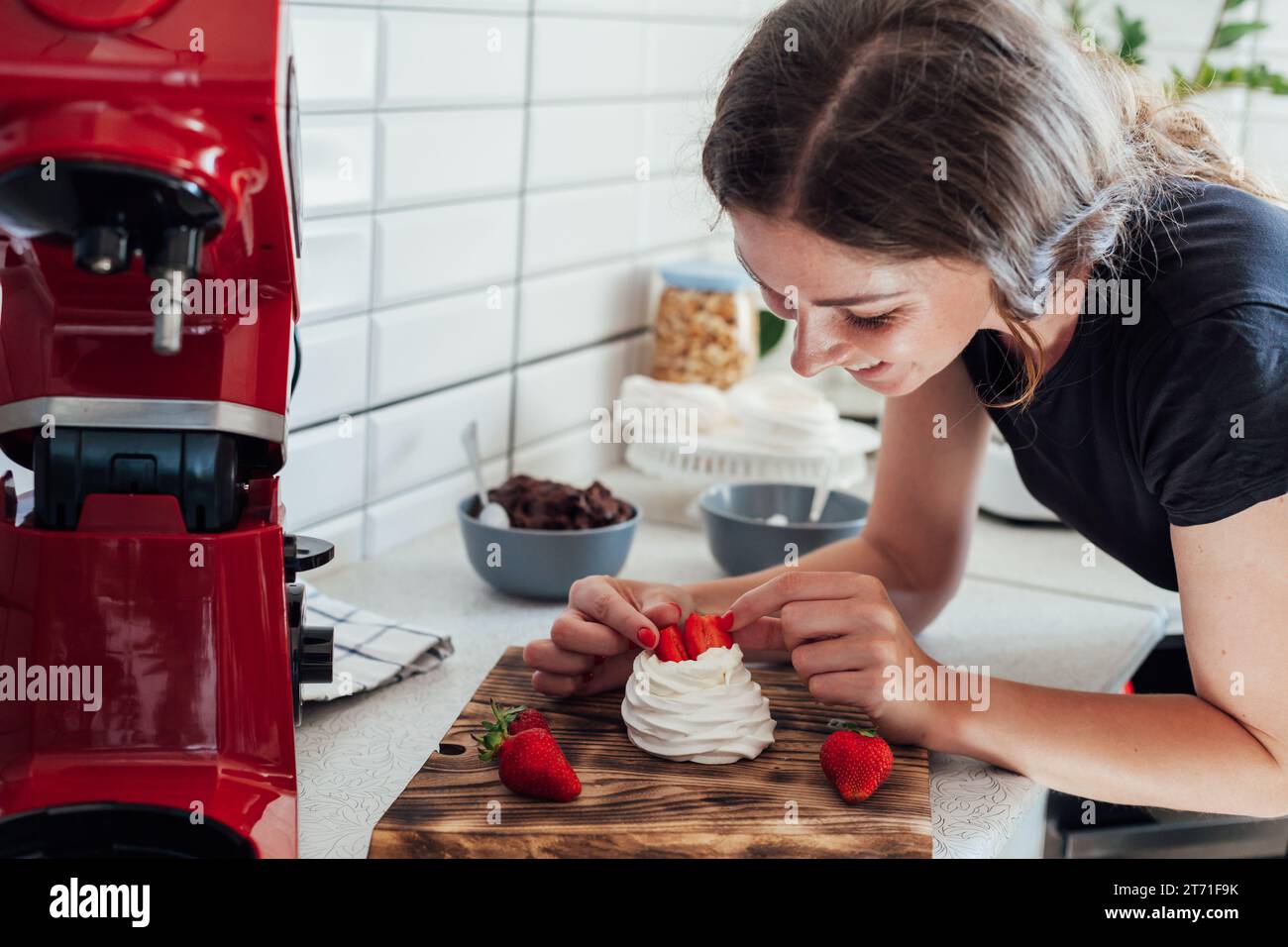 Woman cooks pastries in kitchen hi-res stock photography and images - Alamy