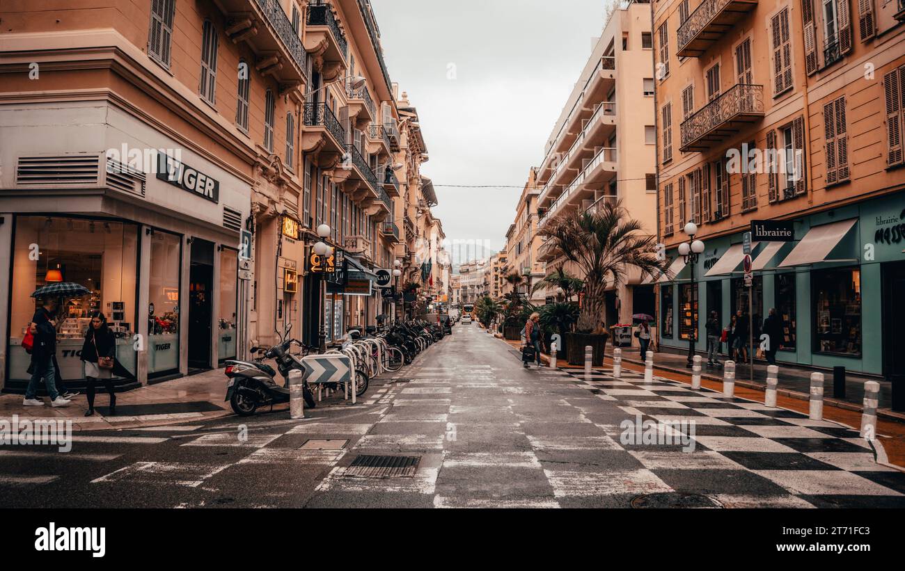 A picturesque alleyway lined with stone buildings in Nice, France Stock ...