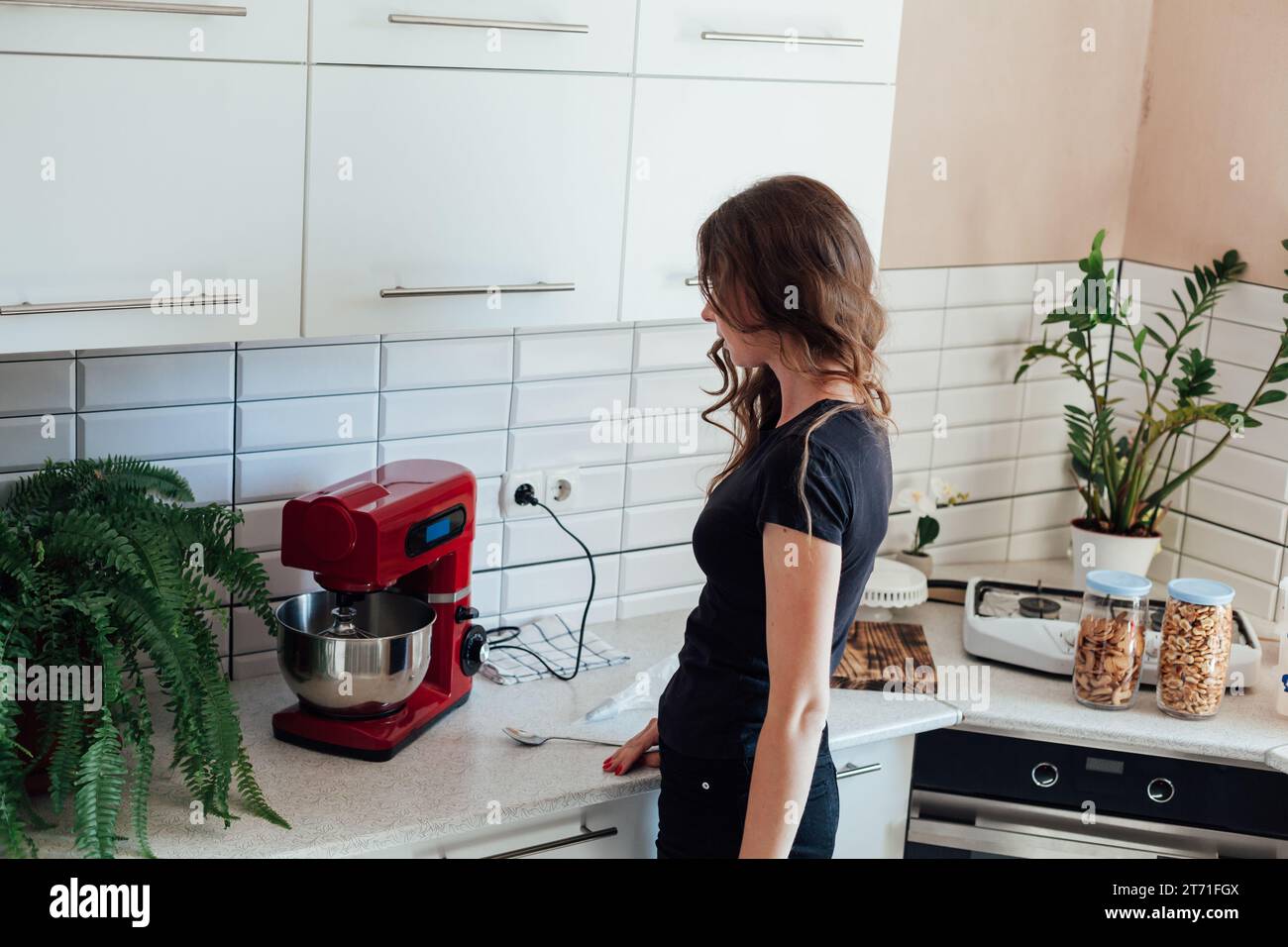 Woman cooks pastries in kitchen hi-res stock photography and images - Alamy