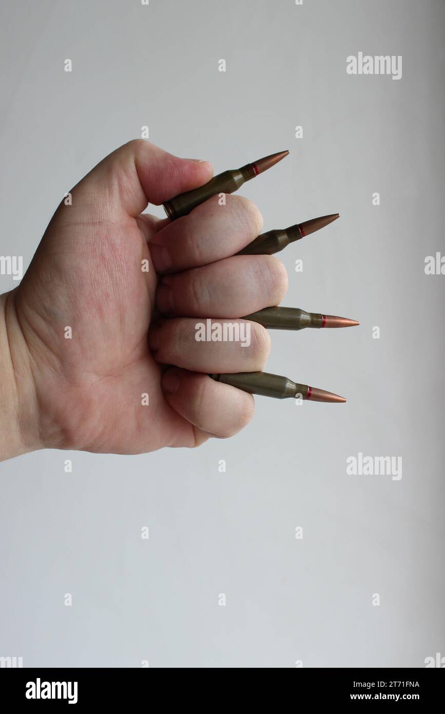 Back Of The Fist Of Man Arm With Bullets Strongly Squeezed In Fingers ...