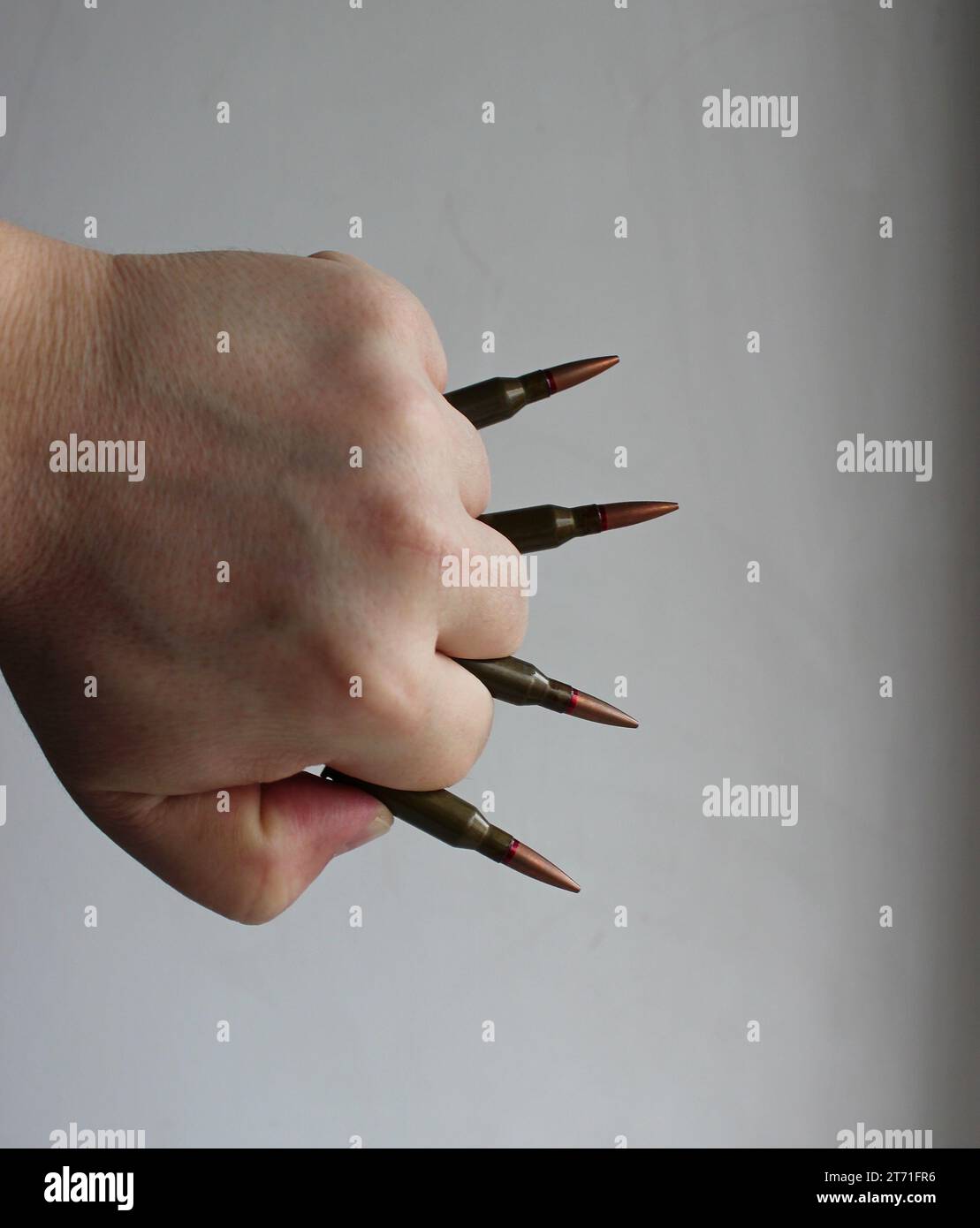 Upper Side Of Human Fist With Bullets Clenched Between Fingers Stock ...