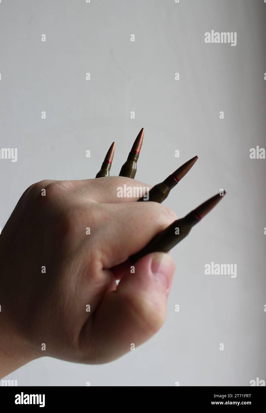 Bullets in hand hi-res stock photography and images - Alamy