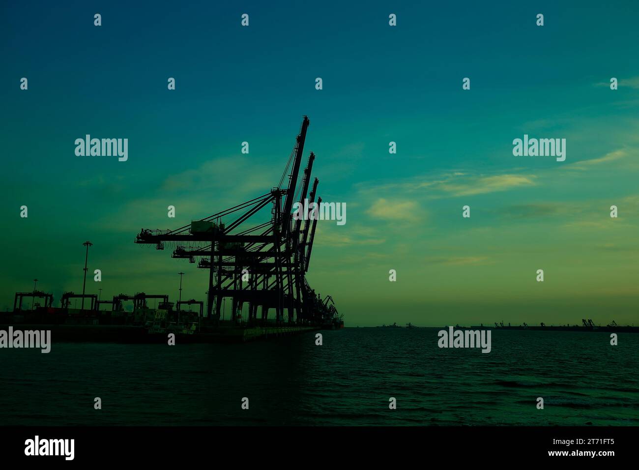 Port crane unloading container ships Stock Photo - Alamy